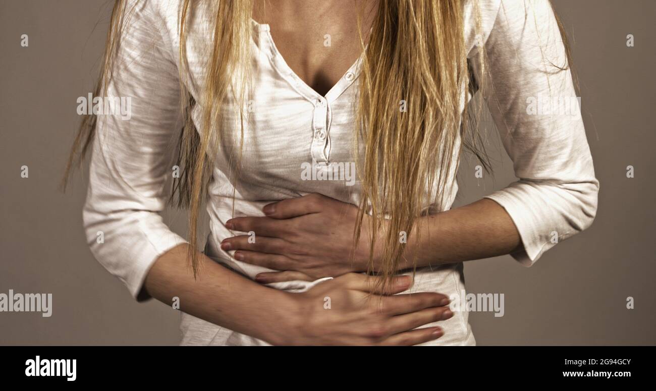 The woman's belly pain. PMS symptoms, menstruation suffer problem Stock ...