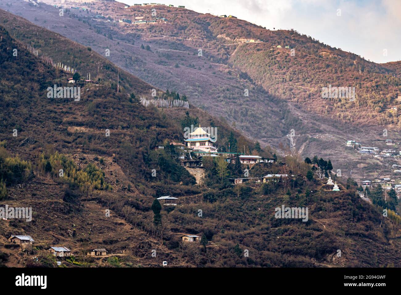 Buddhist monastery situated at mountain foothill at evening image is ...