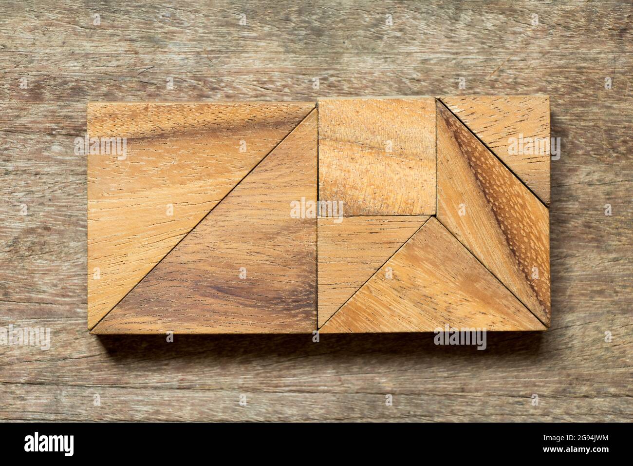 Tangram puzzle in rectangle shape on wood background Stock Photo - Alamy