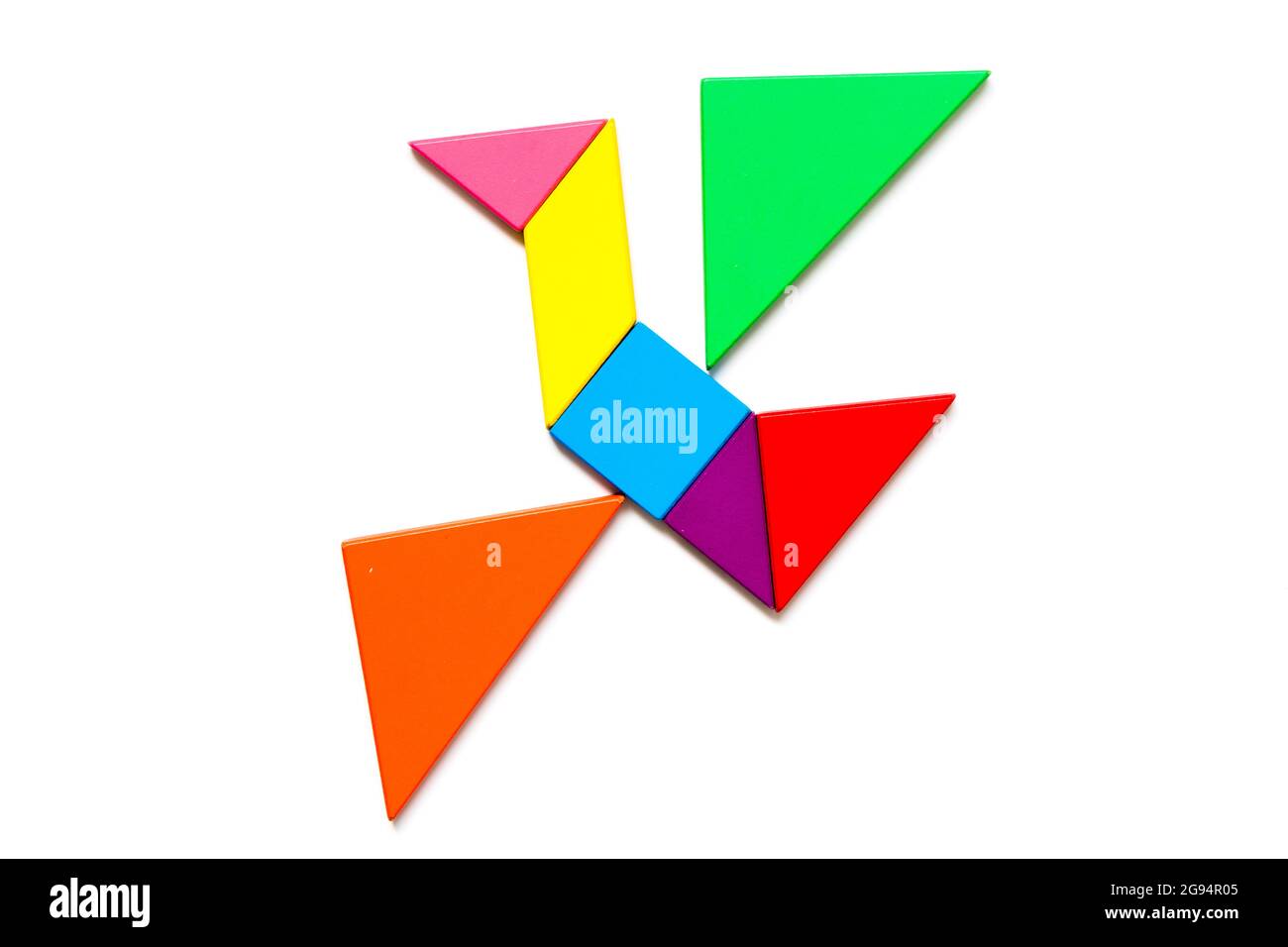 Color wood tangram puzzle in flying bird shape on white background ...