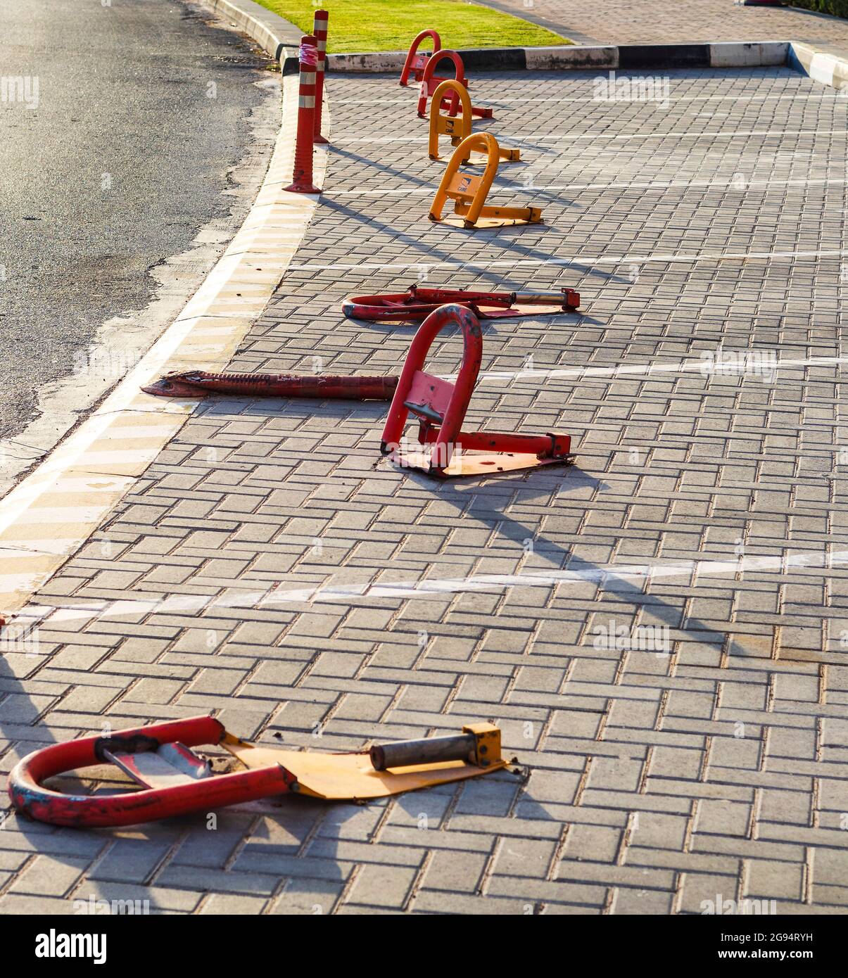 Red and orange parking stoppers Stock Photo - Alamy