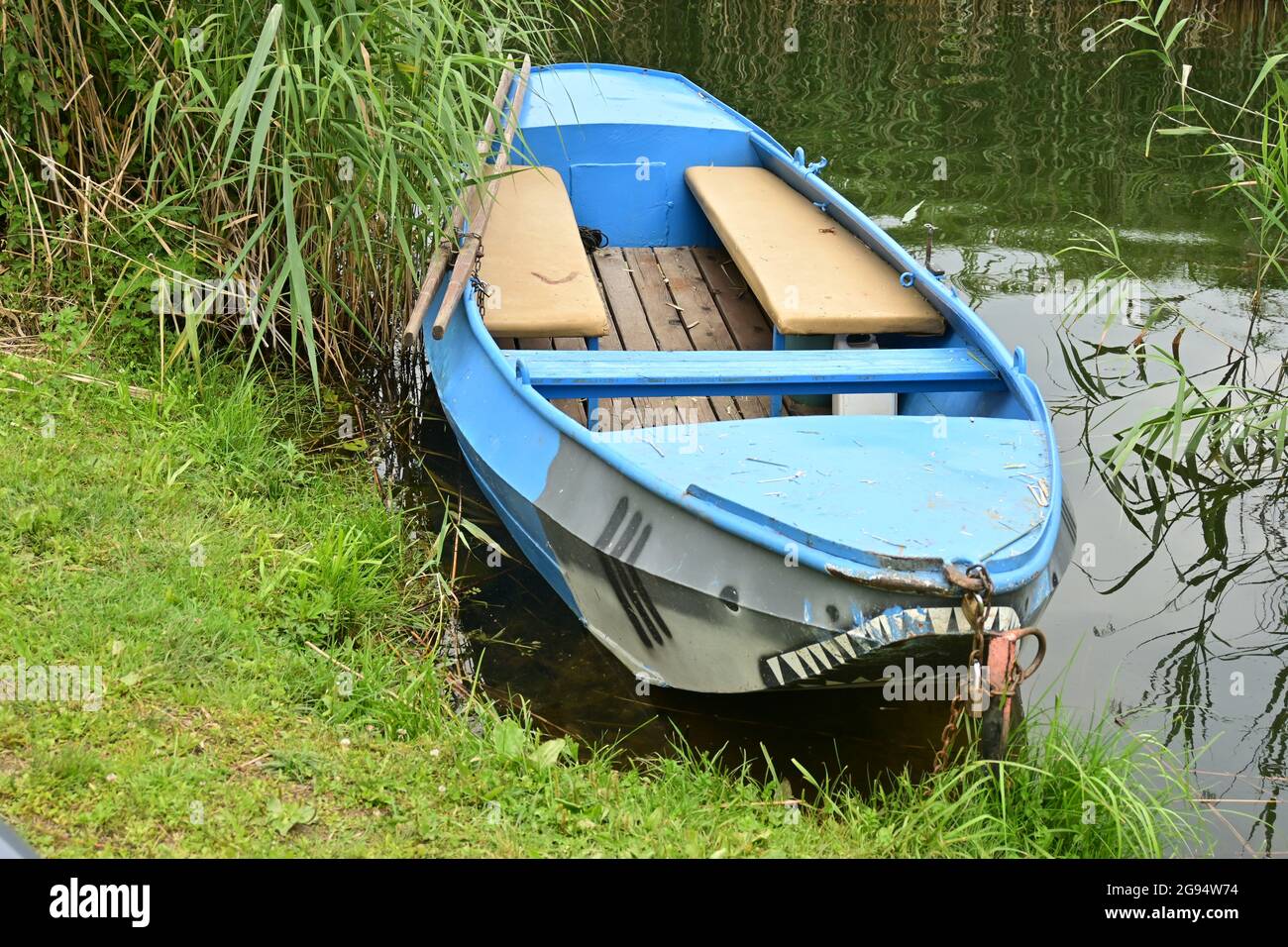Small boat by the lake Stock Photo - Alamy