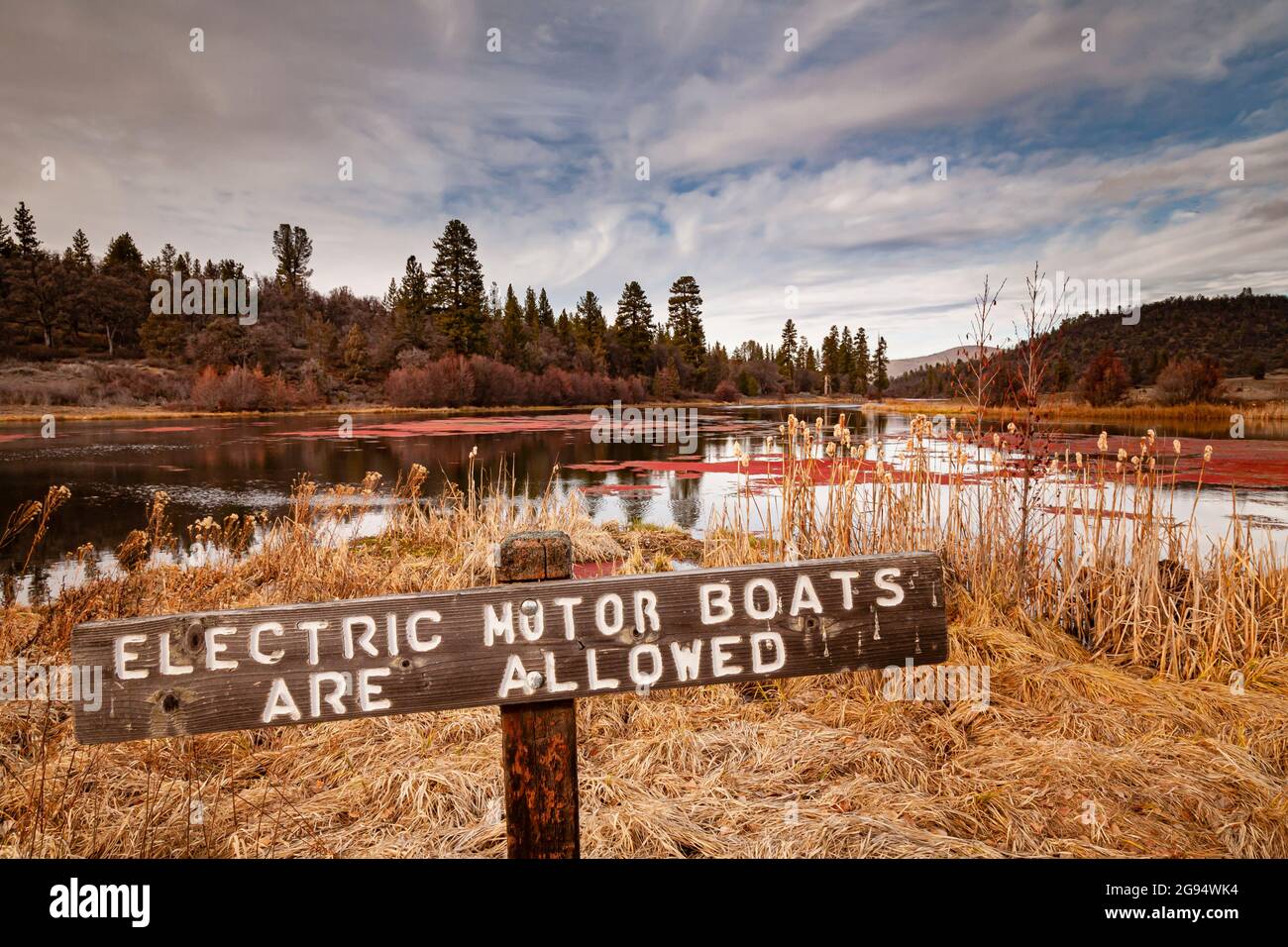 Wooden sign at Baum Lake advising people that electric powered vessels ...