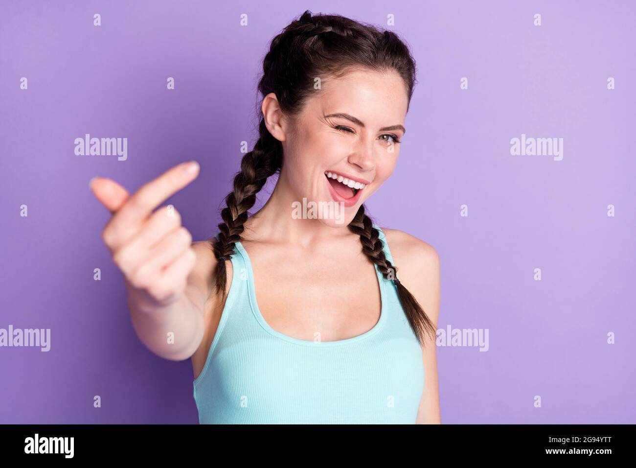 Photo of cheerful brown hair lady invite you wear blue top isolated on ...