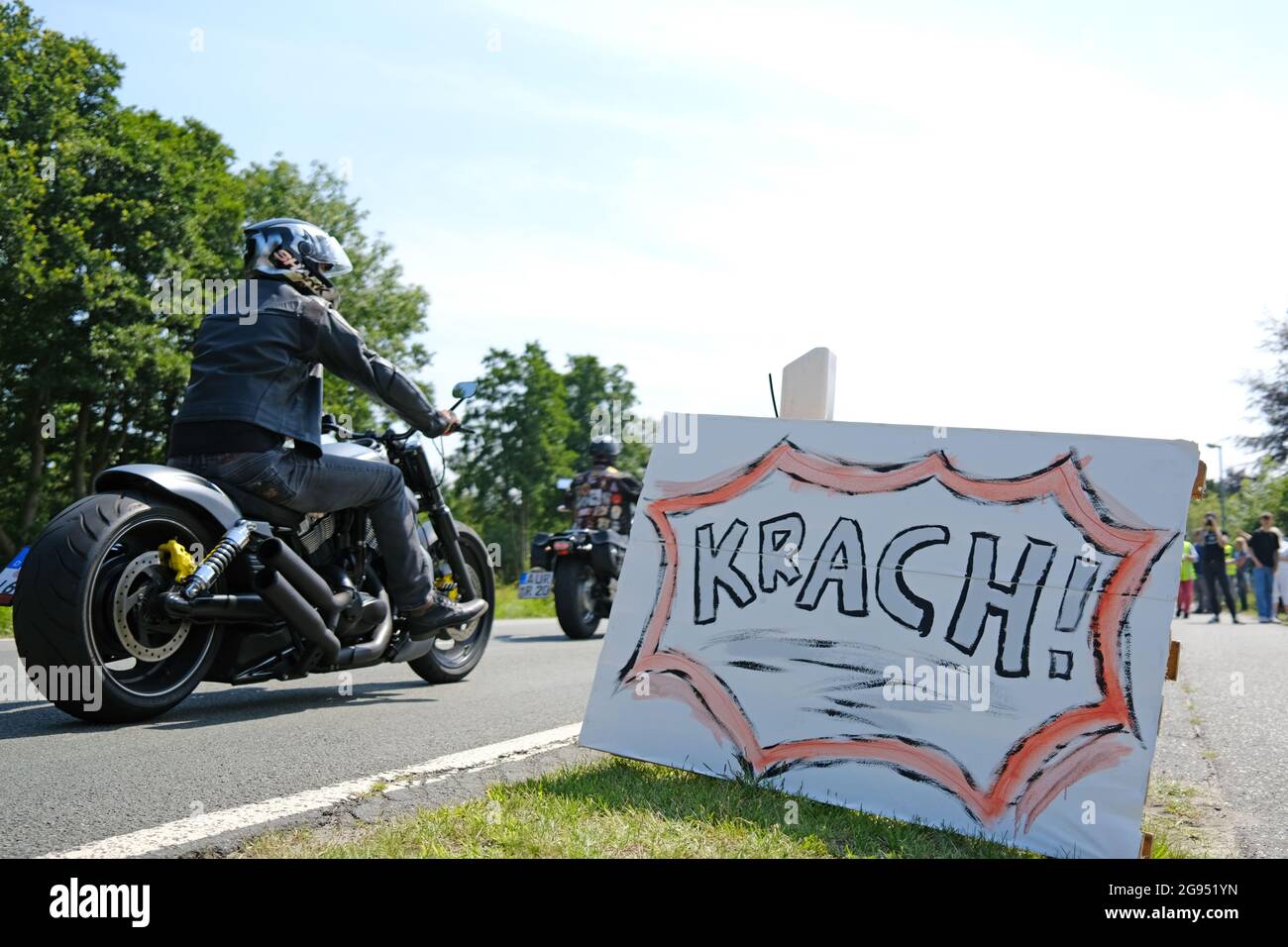 Rhauderfehn, Germany. 24th July, 2021. A motorcyclist rides past the ...