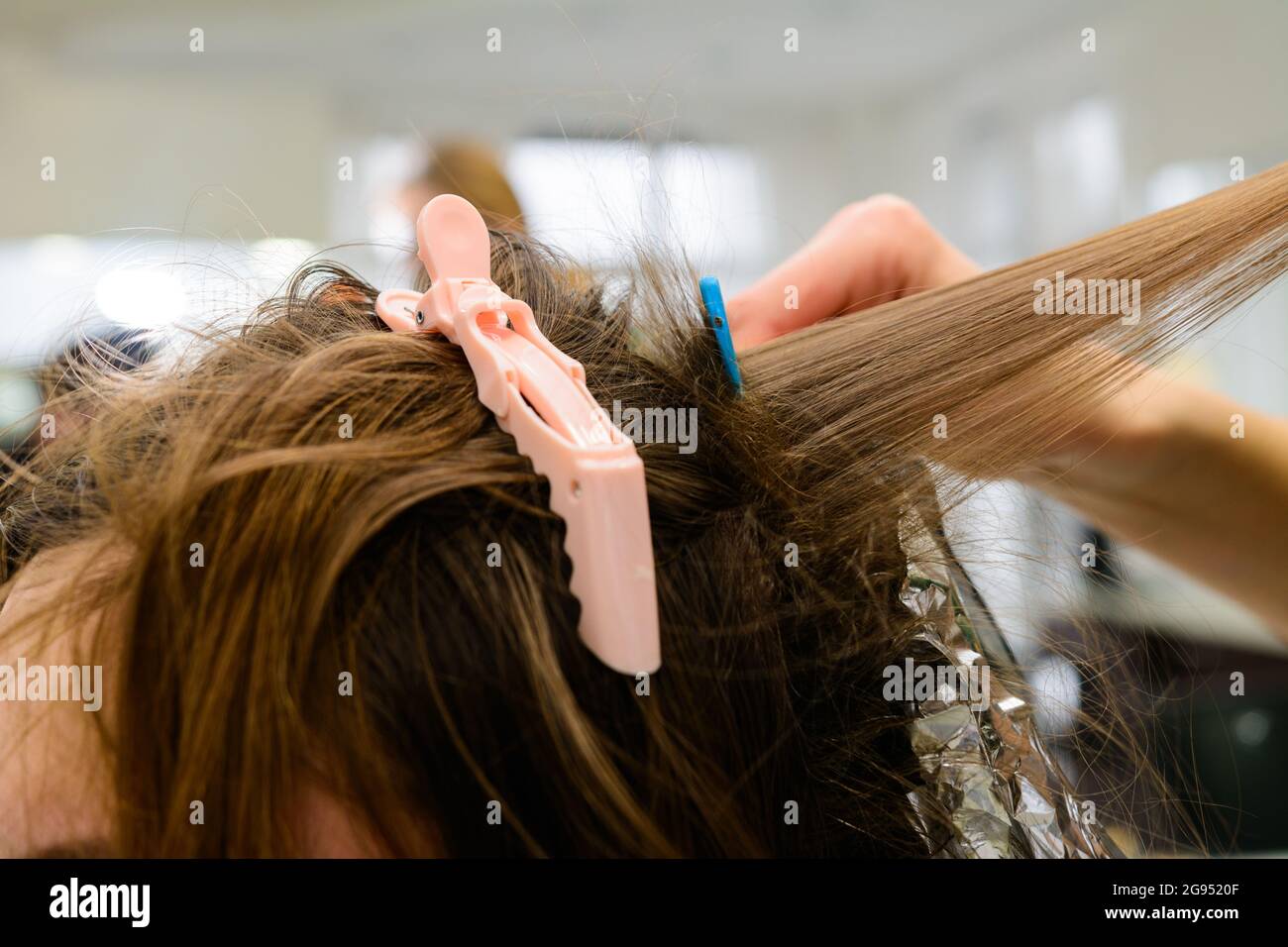 Hair coloring during the quarantine period, client and hairdresser in ...