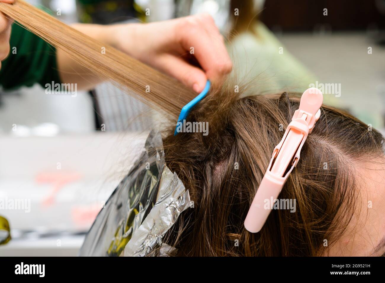 Hair coloring during the quarantine period, client and hairdresser in ...