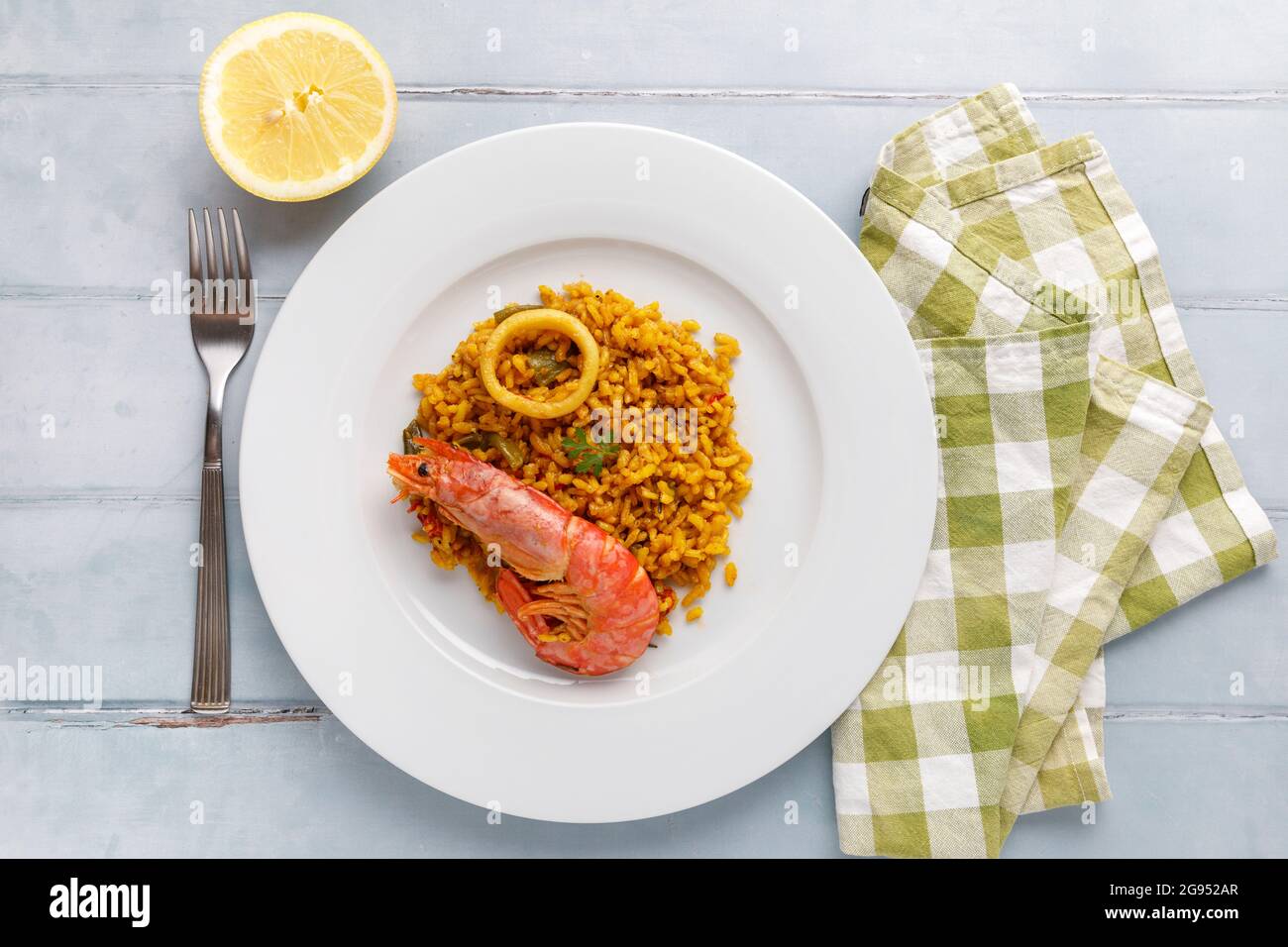 Traditional Spanish paella with seafood and vegetables served on a ...