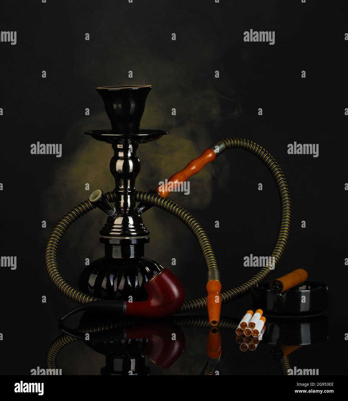 Smoking tools - a hookah, cigar, cigarette and pipe on black background ...