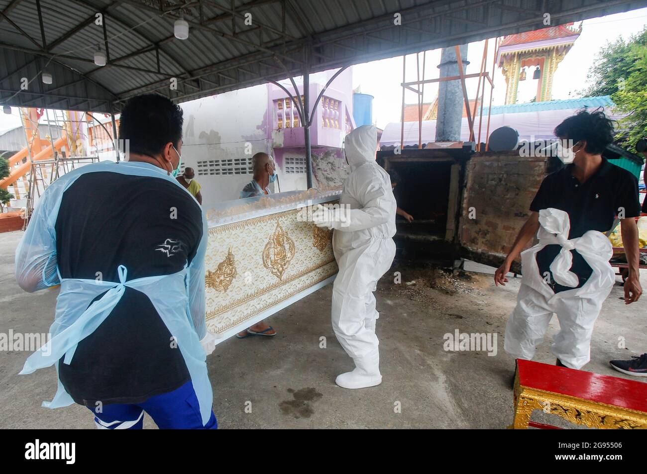 (EDITORS NOTE: Image depicts death) Temple workers wearing personal ...