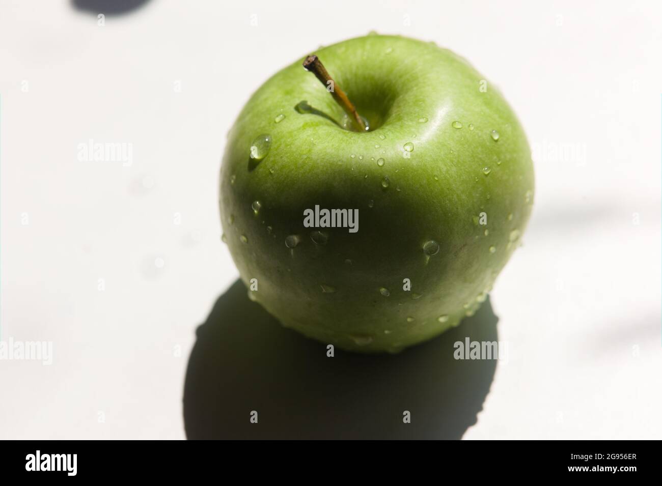 Close-up of a fresh juicy apple on a white background Stock Photo - Alamy