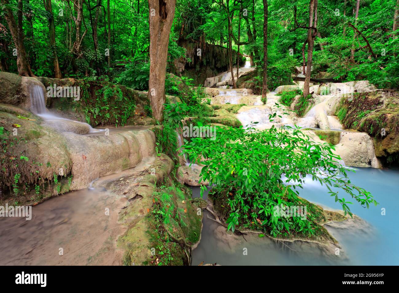 Limestone waterfall in tropical forest, west of Thailand Stock Photo ...