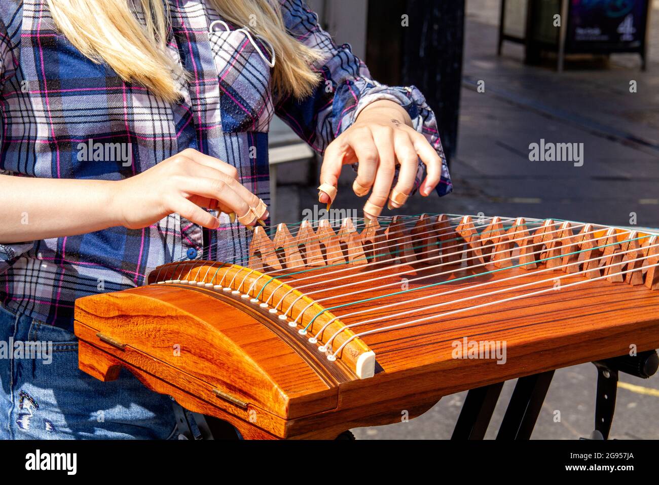 Chinese Girl Playing Traditional Musical Instrument High Resolution ...