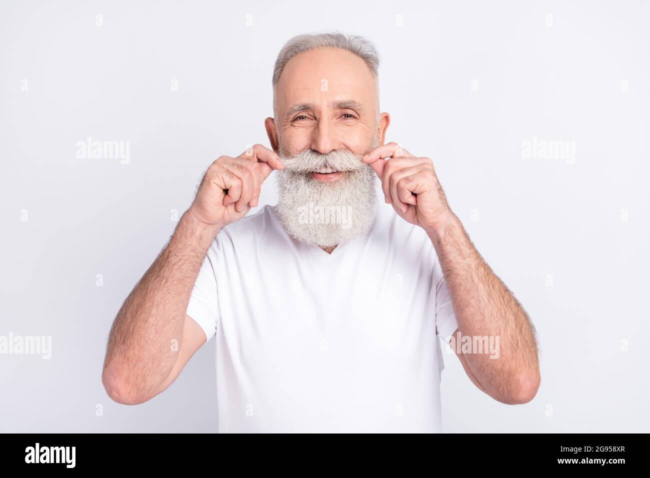 Photo of happy charming attractive old man hold hands mustache fix ...