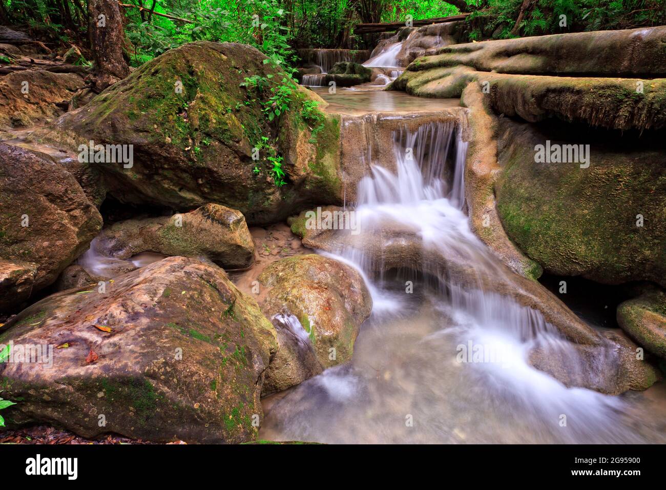 Limestone waterfall in tropical forest, west of Thailand Stock Photo ...
