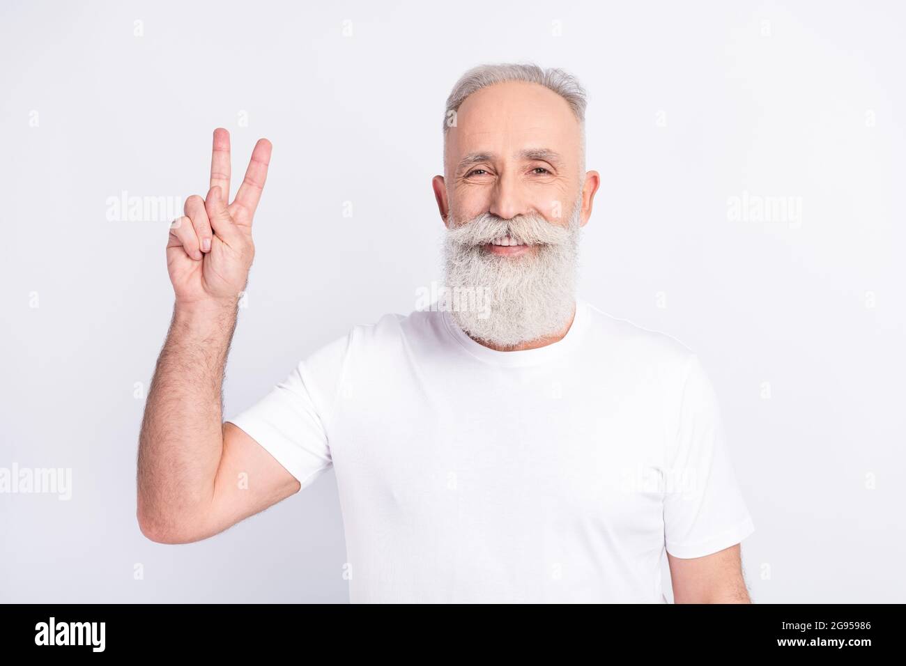 Photo of positive charming happy old man show v-sign hello cool good ...