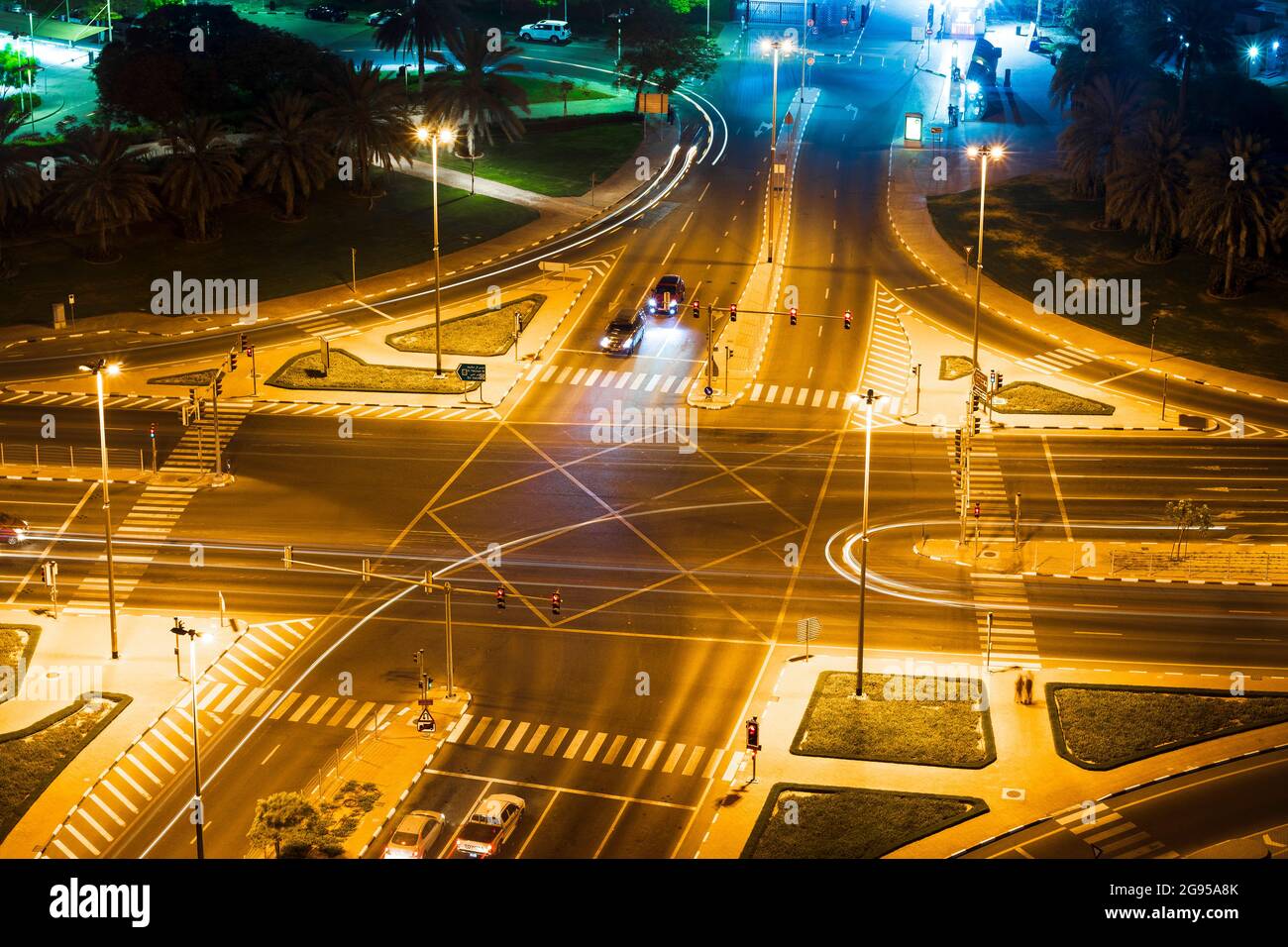 Cross road junction with light trails from cars Stock Photo - Alamy