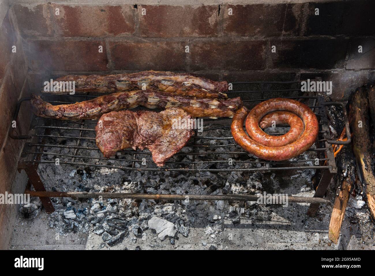 Grilled beef and pork sausages, traditional Argentine Asado, La Pampa ...