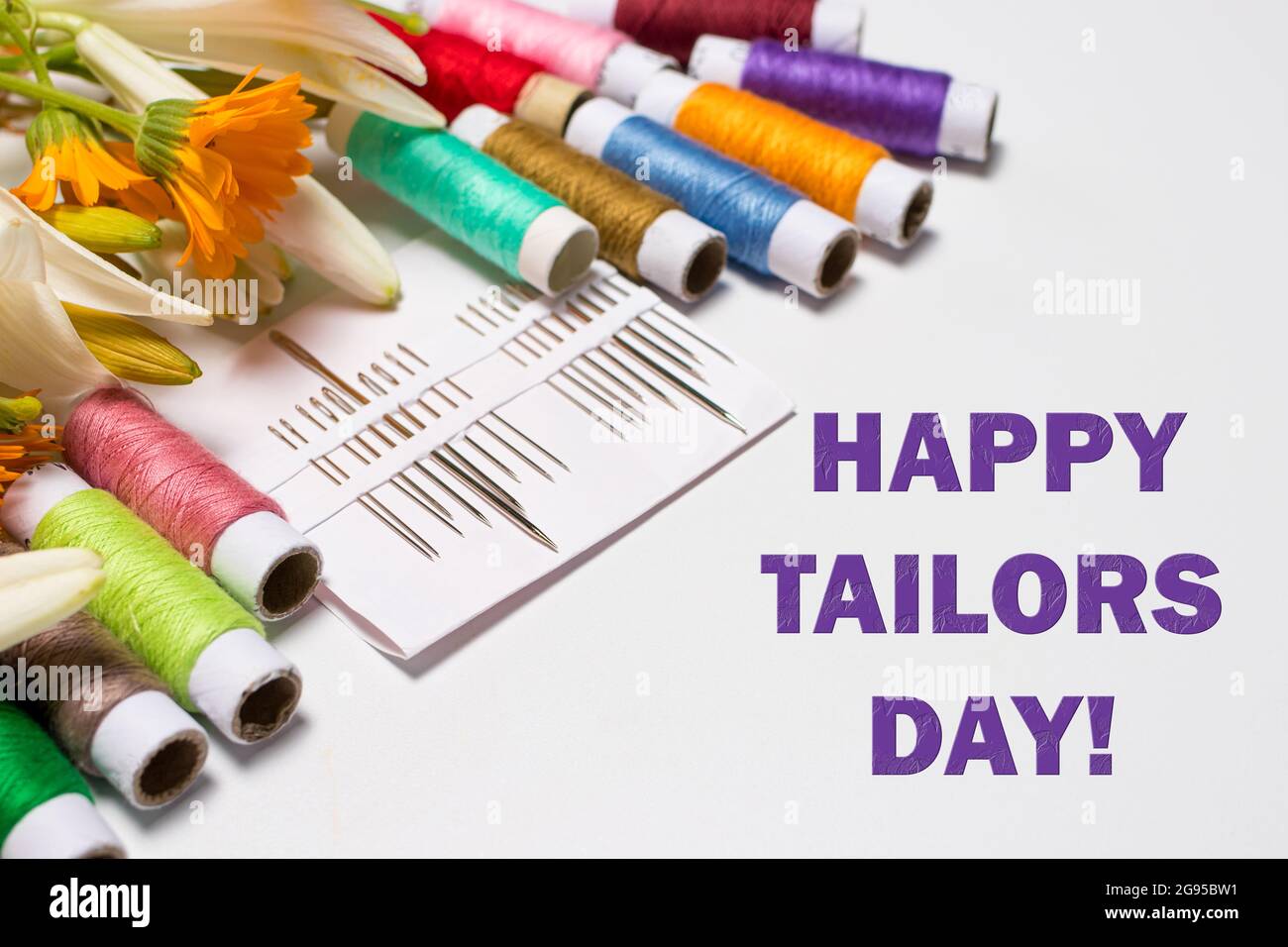 Greeting card with multi-colored threads and the text Happy Tailors Day. For the holiday of a ...