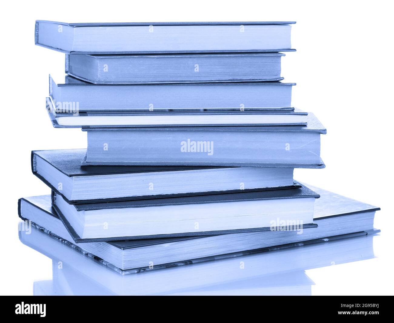 Stack of books in blue light Stock Photo - Alamy
