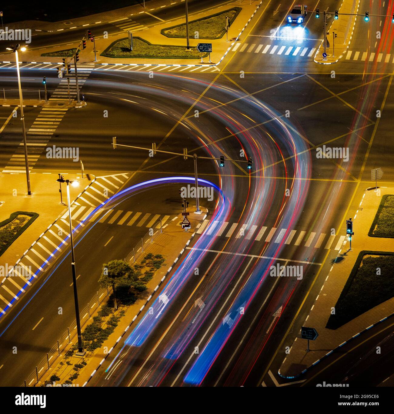 Cross road junction with light trails from cars Stock Photo - Alamy