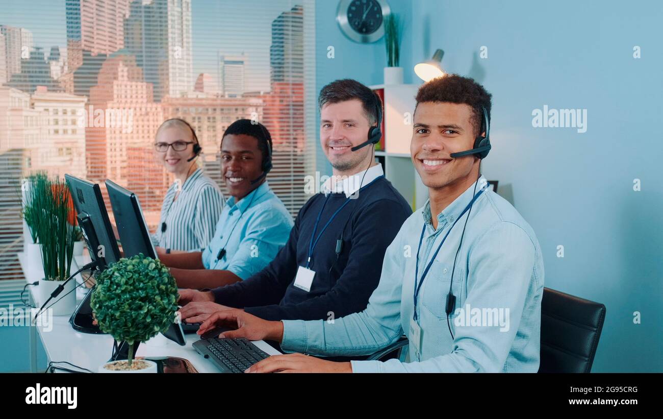 Medium shot of Diverse team of call center customers looking to the ...