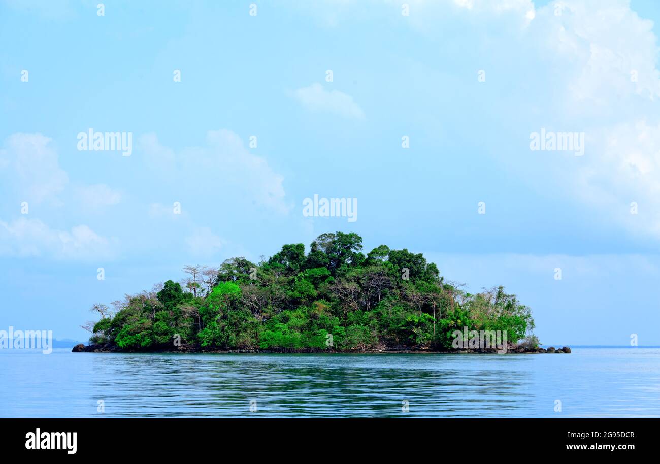 Small island in tropical sea Stock Photo - Alamy