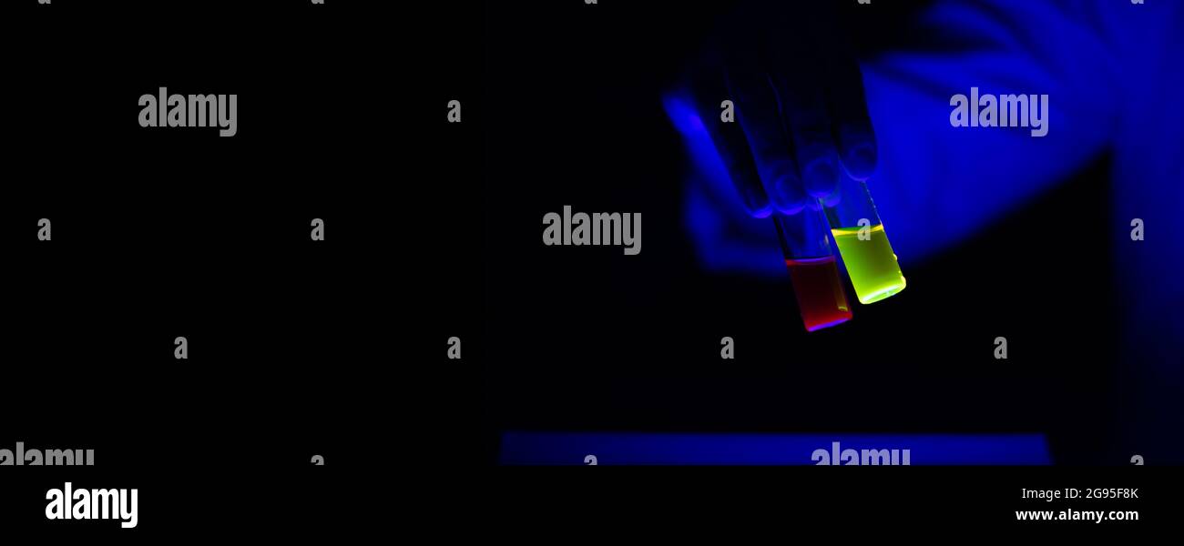 Toxic organic chemical sample glass vials hold by a woman scientist in ...