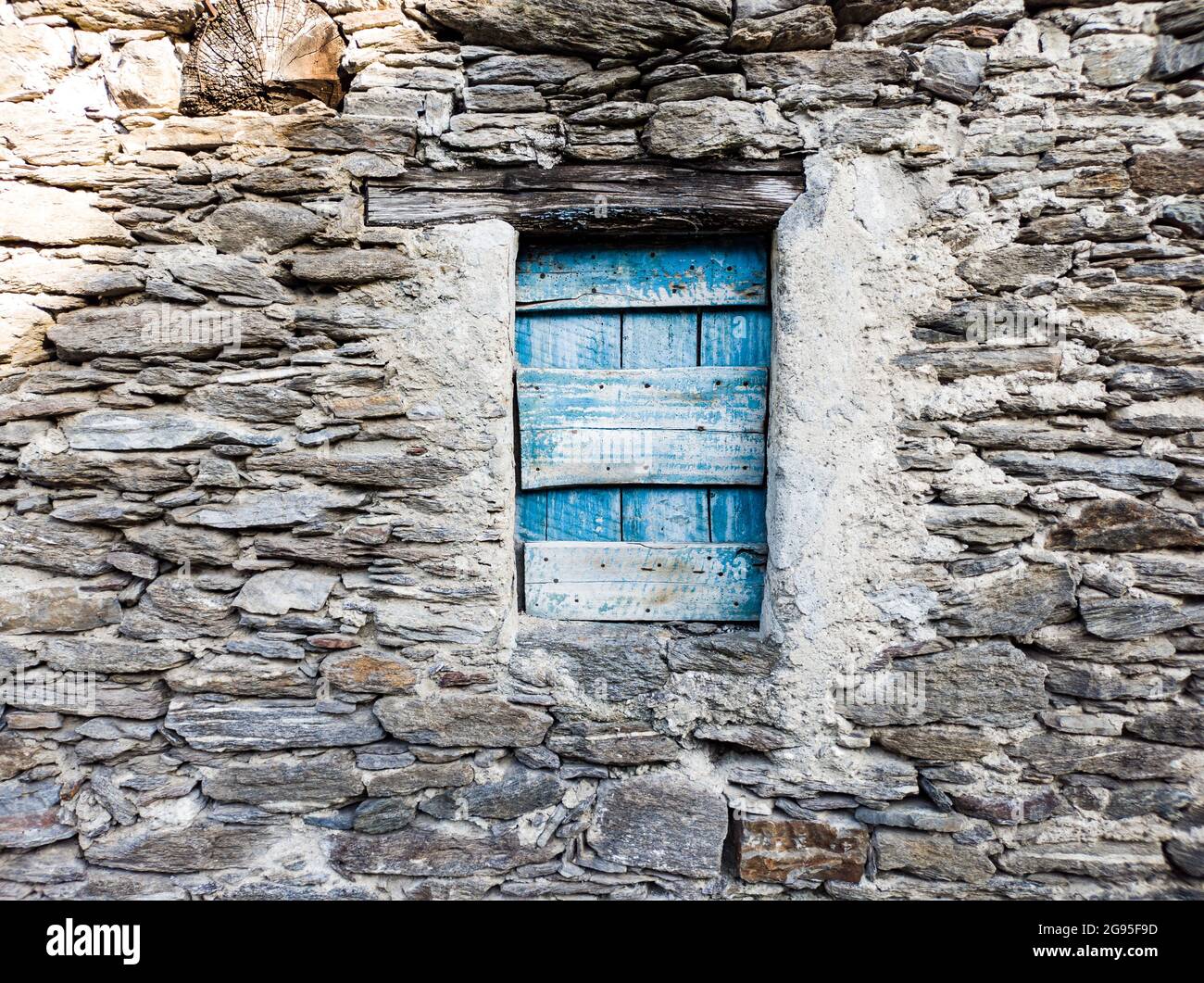 Blue window in a stone wall Stock Photo - Alamy