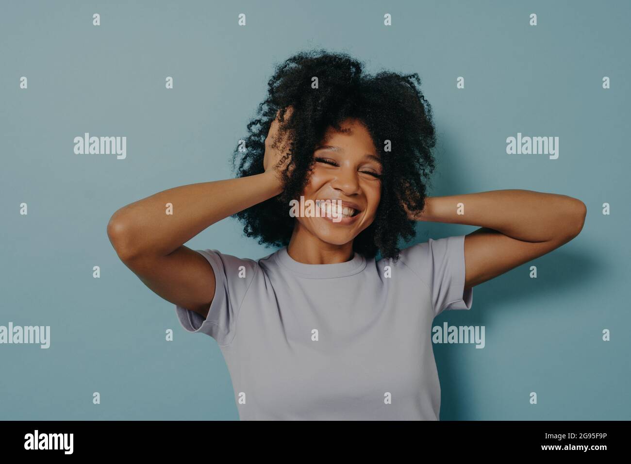 Portrait of happy surprised young woman looking excited in full ...