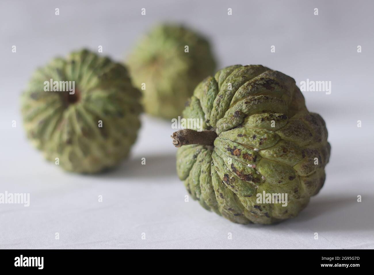 Cherimoya is a green, cone-shaped fruit with leathery skin and creamy ...