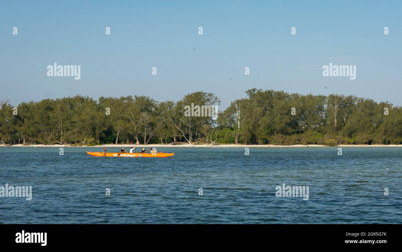 Group of people on a outrigger canoe iat a tropical landscape Stock ...