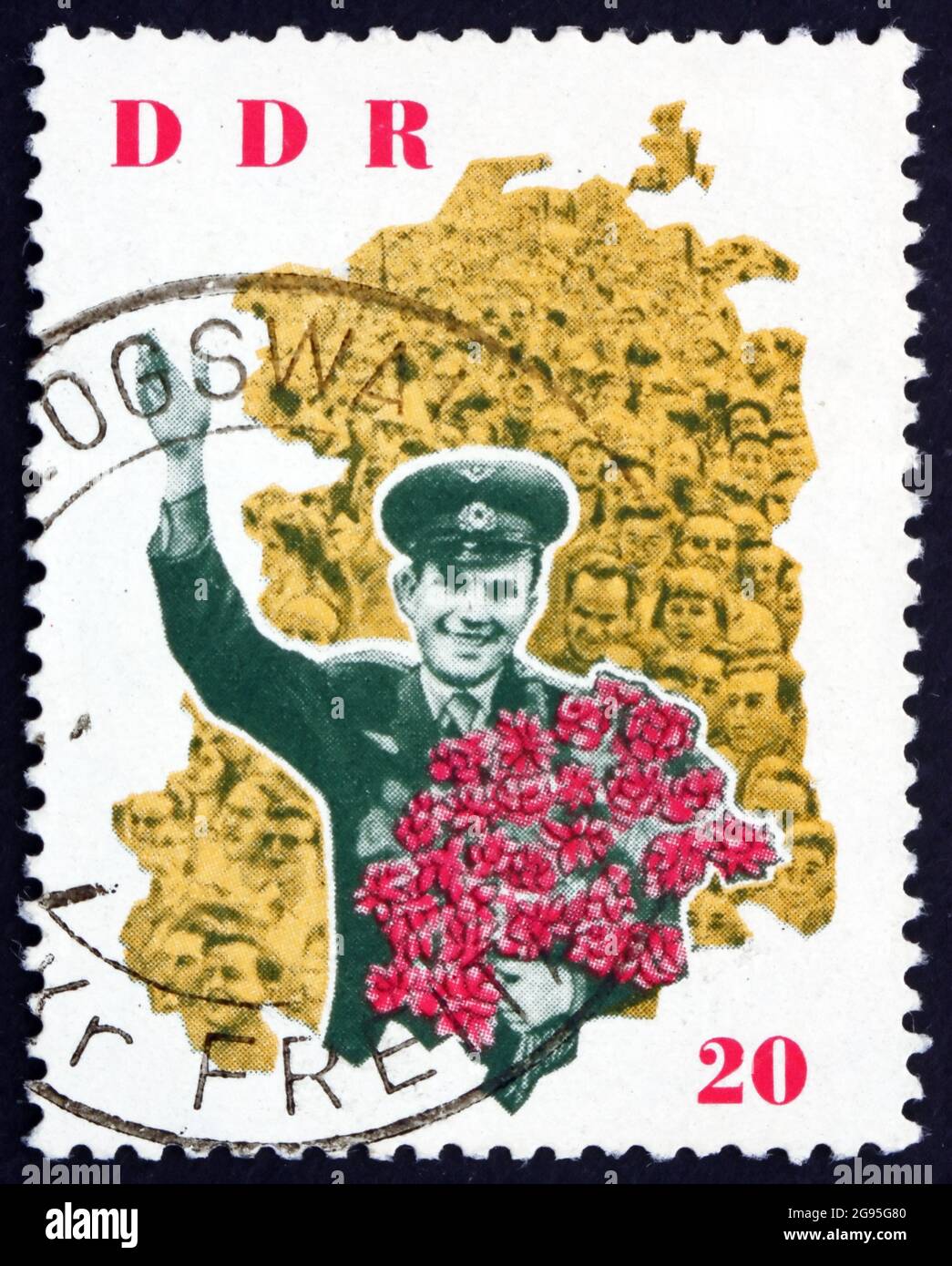 GDR - CIRCA 1963: a stamp printed in GDR shows Yuri Gagarin and map of ...