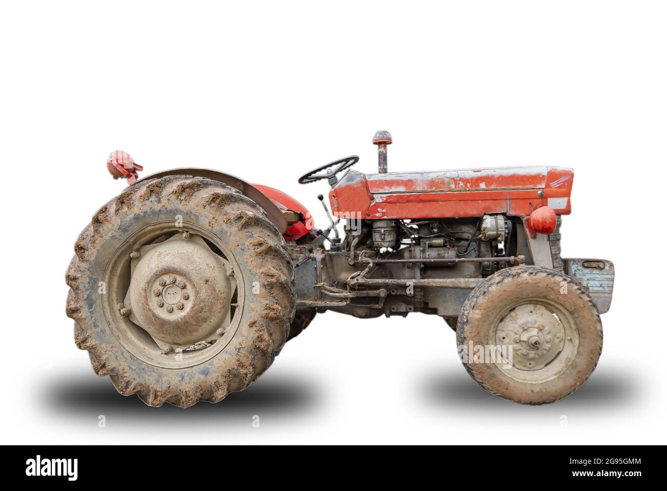 Old retro red tractor with isolated white background Stock Photo - Alamy