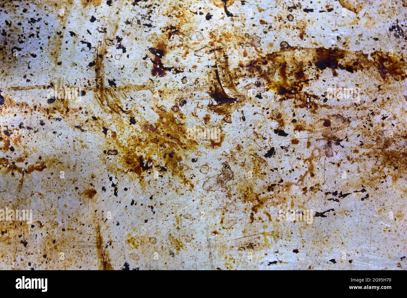 Silver metallic background showing multiple signs of wear and tear with ...