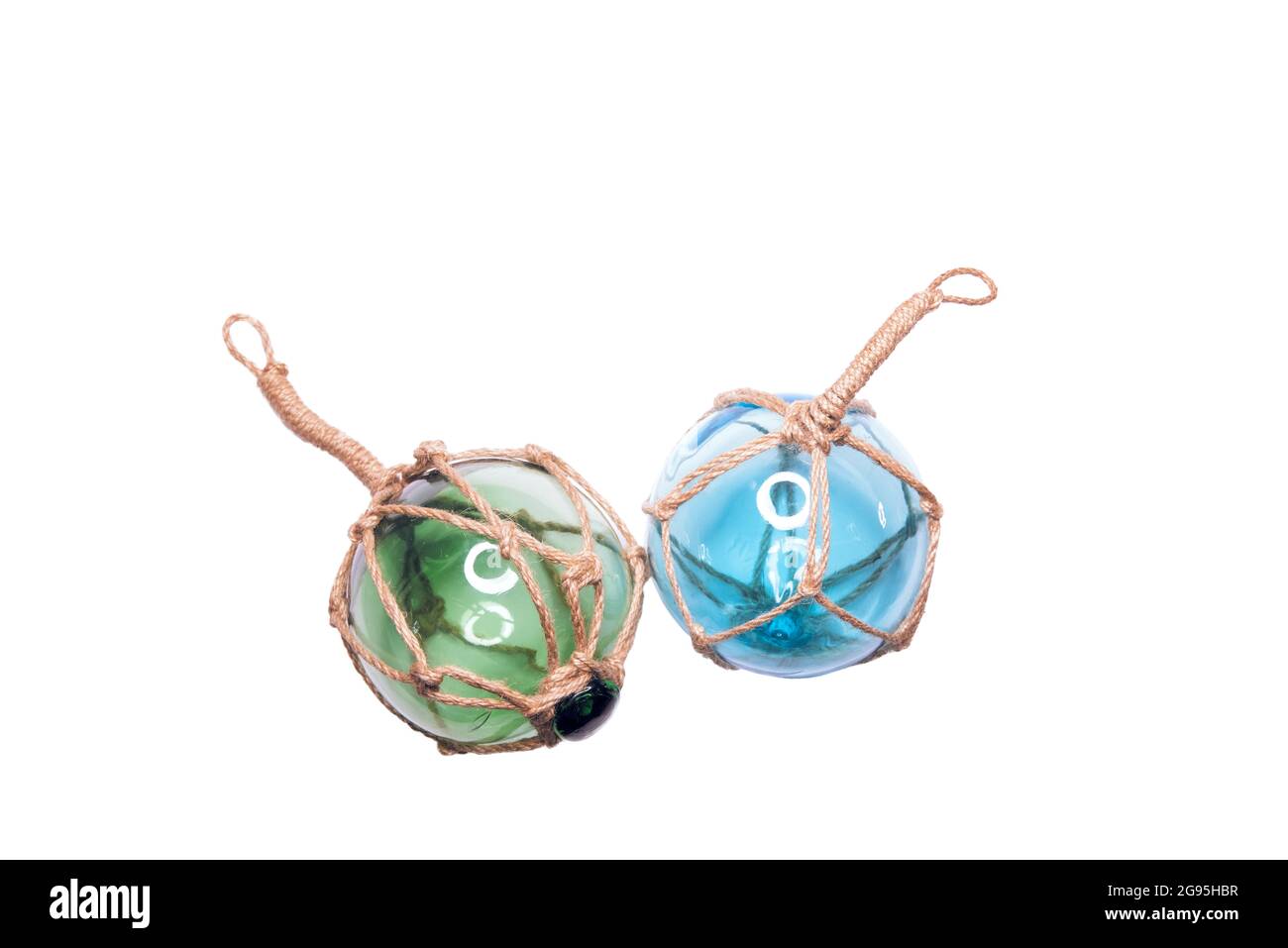 Glass fishing net round buoys. Couple glass spheres with ropes isolated ...