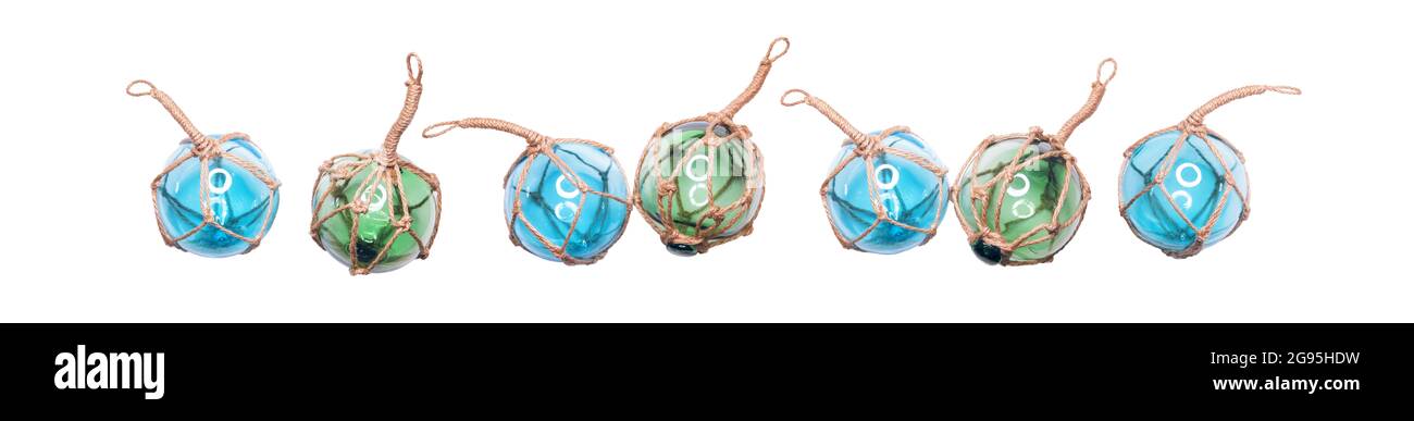 Glass fishing net round buoys. Many of glass spheres with ropes ...
