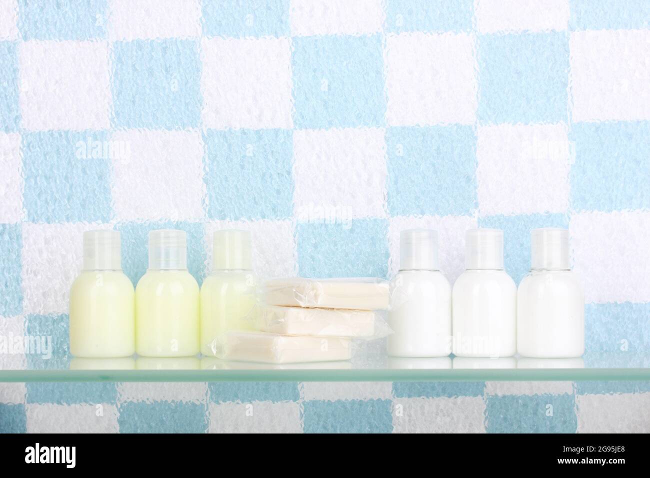 Hotel amenities kit on shelf in bathroom Stock Photo - Alamy