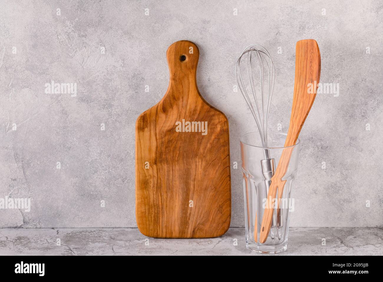 Kitchen utensils for eating and cooking on a light table Stock Photo ...