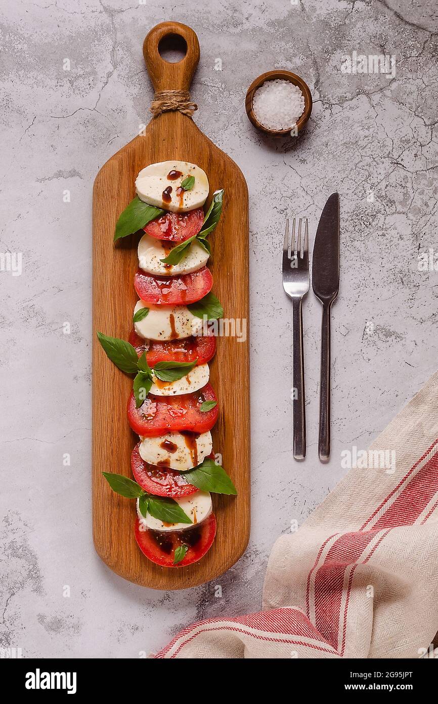 Italian caprese salad with sliced tomatoes, mozzarella, basil, olive ...
