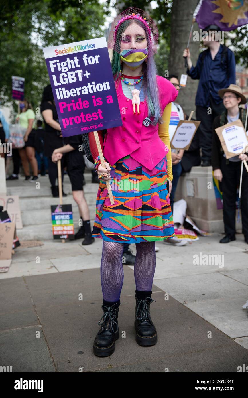 London, UK. 24th July, 2021. LGBTI supporter holds a placard at ...