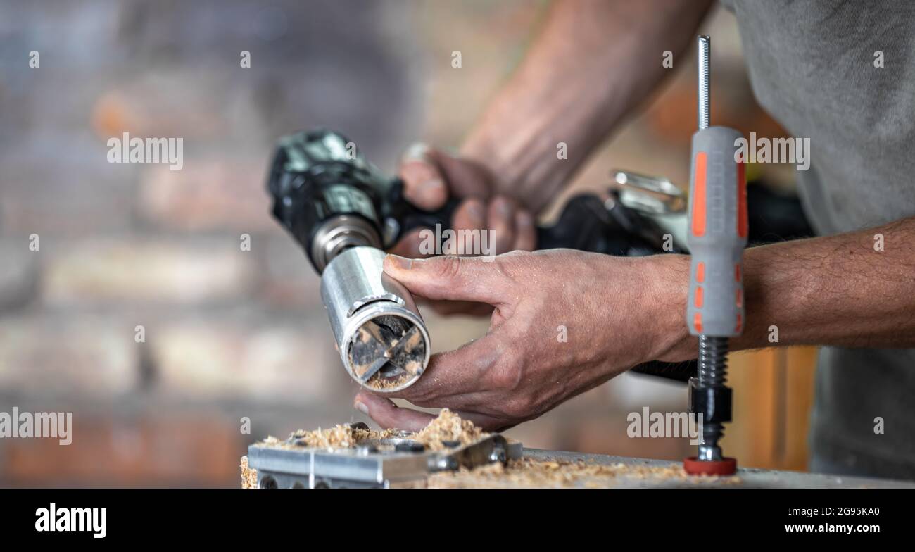 Close up a carpenter working with wood and building tools in house ...