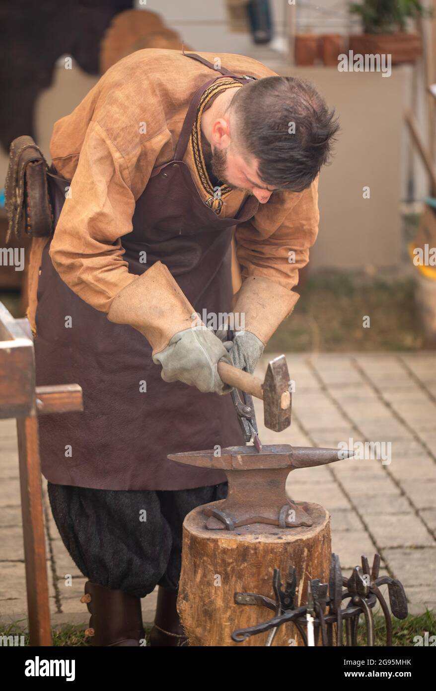 Gniezno, Poland - 07.24.2021: Blacksmith in medieval costume recreates ...