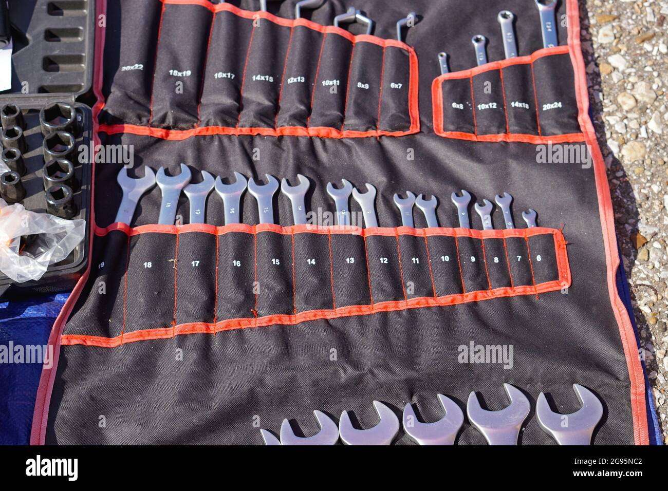 Big set of wrench spanners in tool bag wrap Stock Photo - Alamy