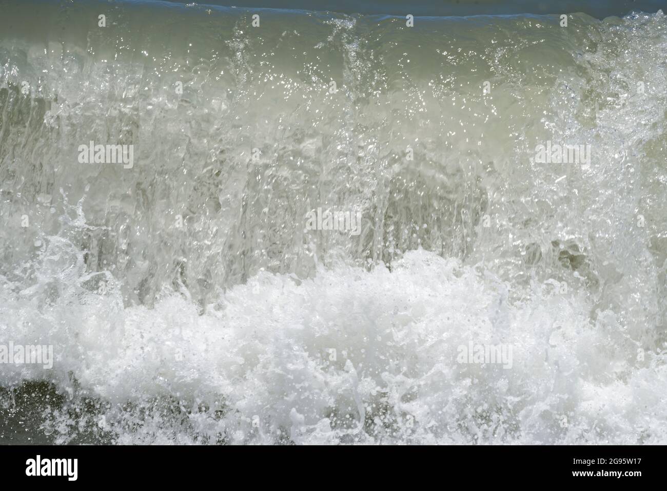 Just sea ocean waves on beach daytime Stock Photo - Alamy
