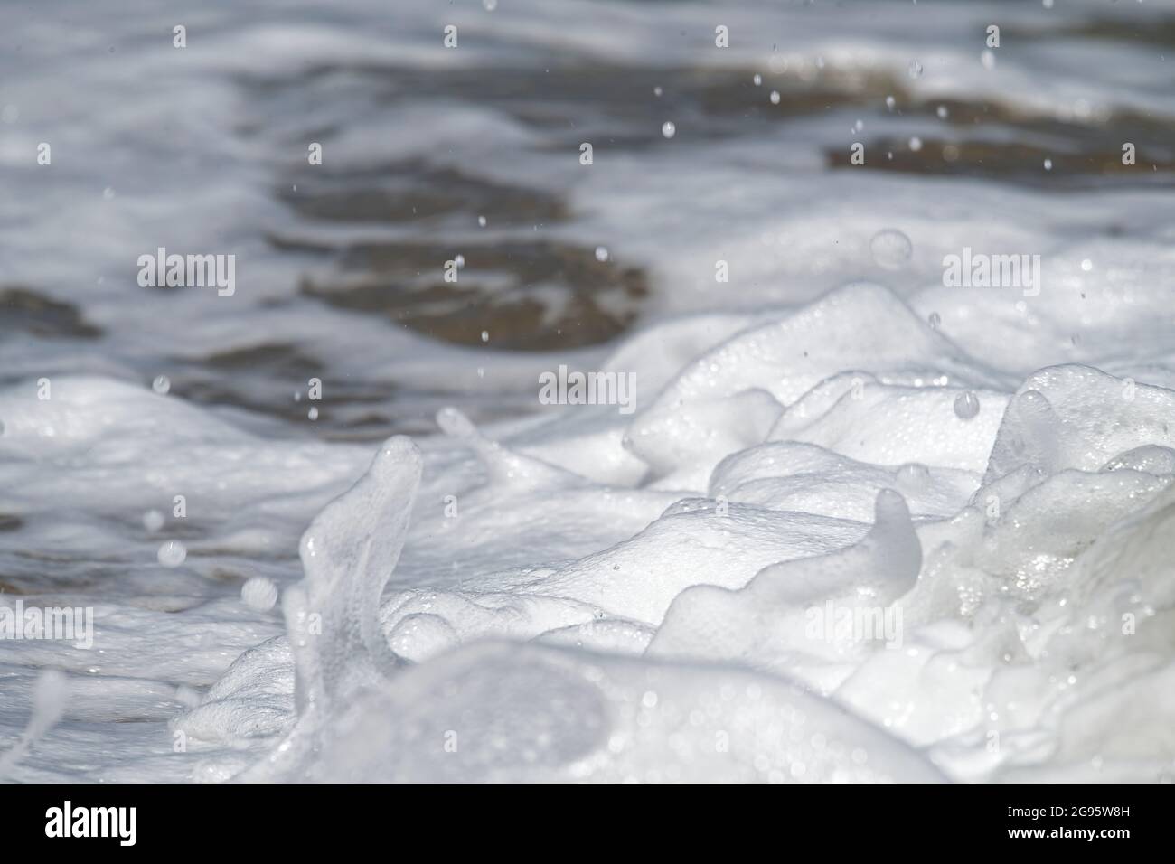 Just sea ocean waves on beach daytime Stock Photo - Alamy