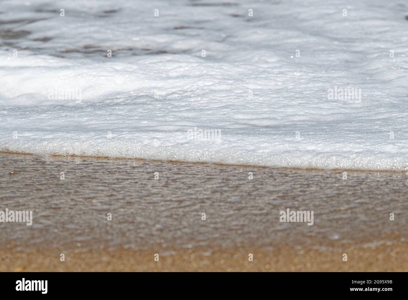 Just sea ocean waves on beach daytime Stock Photo - Alamy