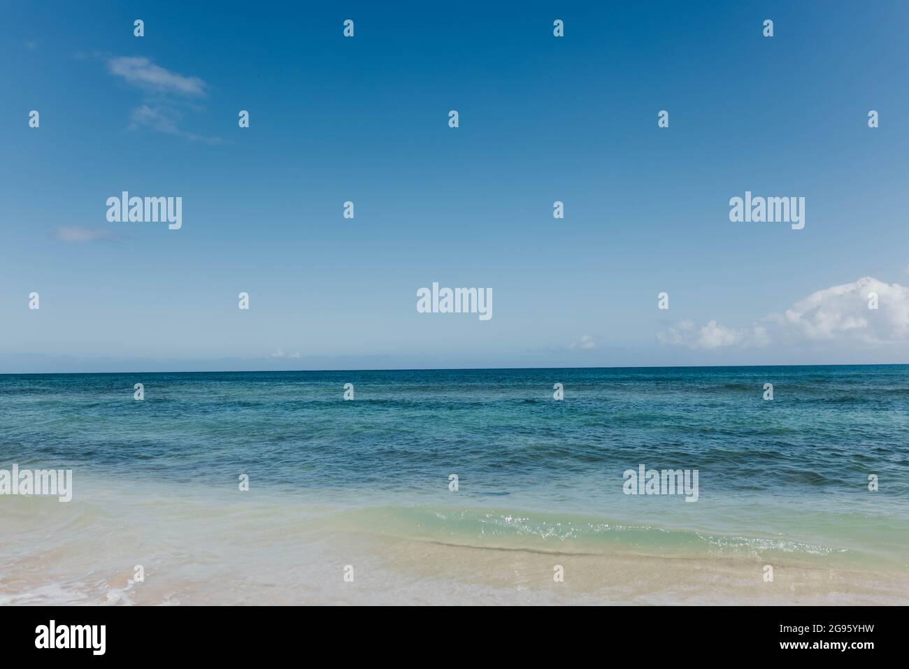 Crashing ocean waves hit along an Oahu beach shoreline Stock Photo - Alamy