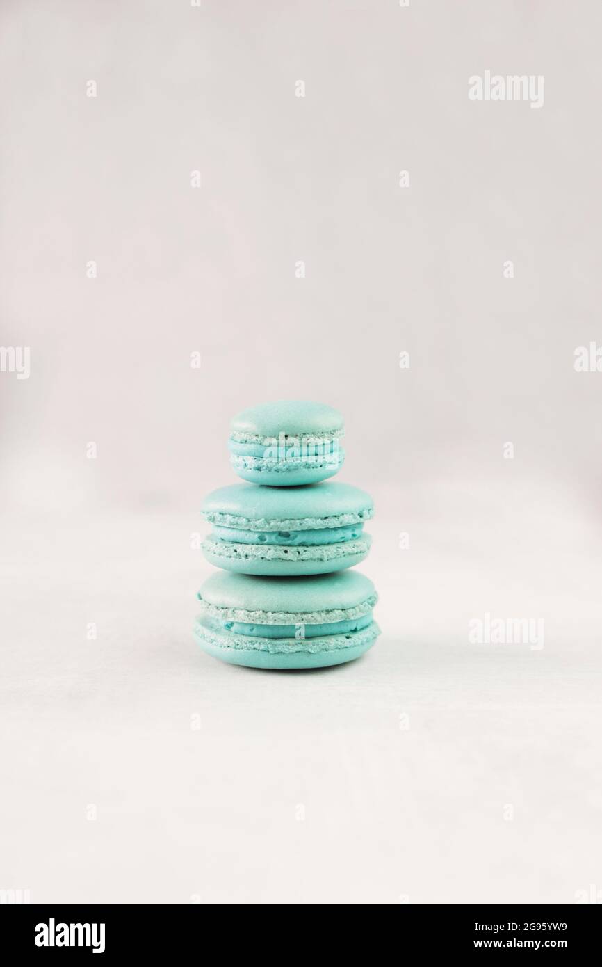 Stack of three macarons against white background Stock Photo - Alamy