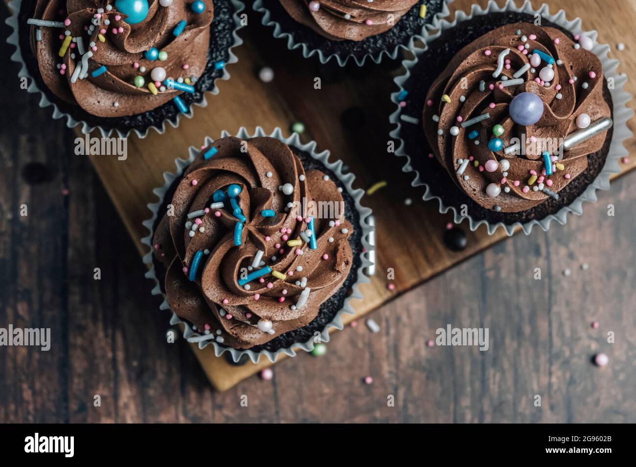 Close up of chocolate cupcakes with sprinkles Stock Photo - Alamy